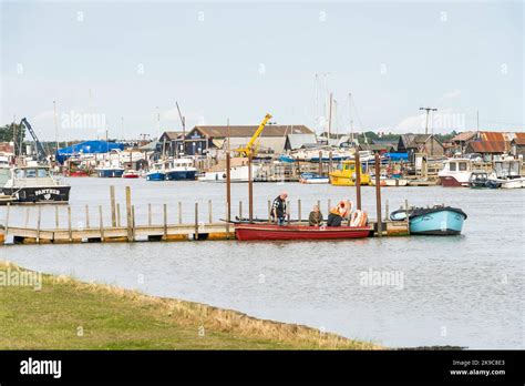 People Sat In Ferry Boat Waiting To Be Rowed Across River Blyth Walberswick Suffolk 2022 Stock