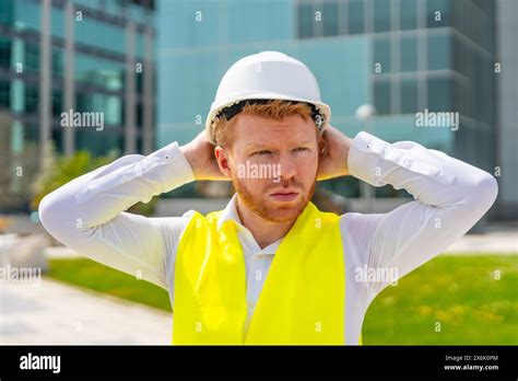 Architect Getting Ready With Safe Gear Adjusting The Hardhat In A Modern Financial District