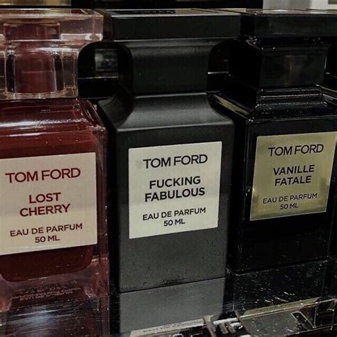 three bottles of tom ford's lost cherry perfumes on display in a store