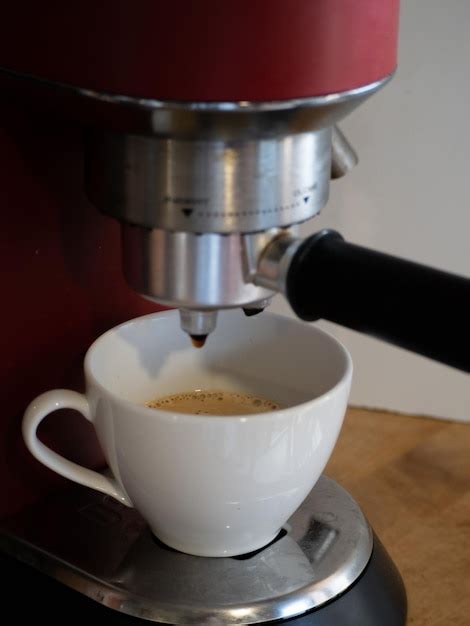 Premium Photo Red Coffee Machine Making Espresso Coffee
