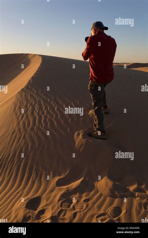 Man Photographing Sand Dunes At Sunset Algodones Sand Dunes Imperial