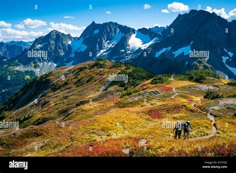 Couple With Backpacks Hiking On Sahale Arm Trail Cascade Pass North