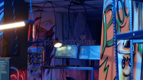 Software Interface On Computer Screens In Empty Criminals Den Stock