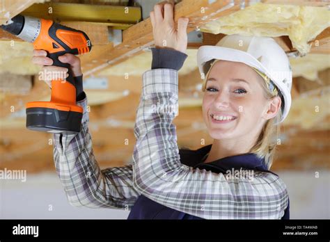 Happy Female Drilling Indoors Stock Photo Alamy