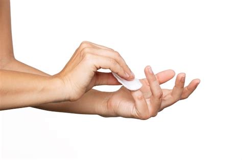Premium Photo Cropped Shot Of A Young Woman Removing Nail Polish With