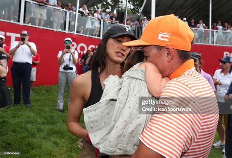 Pga Golfer Rickie Fowler Holding His Daughter Maya Fowler And With