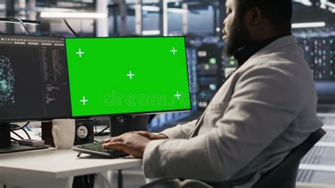 Data Center Programmer Coding On Green Screen Pc Monitoring Ai Systems
