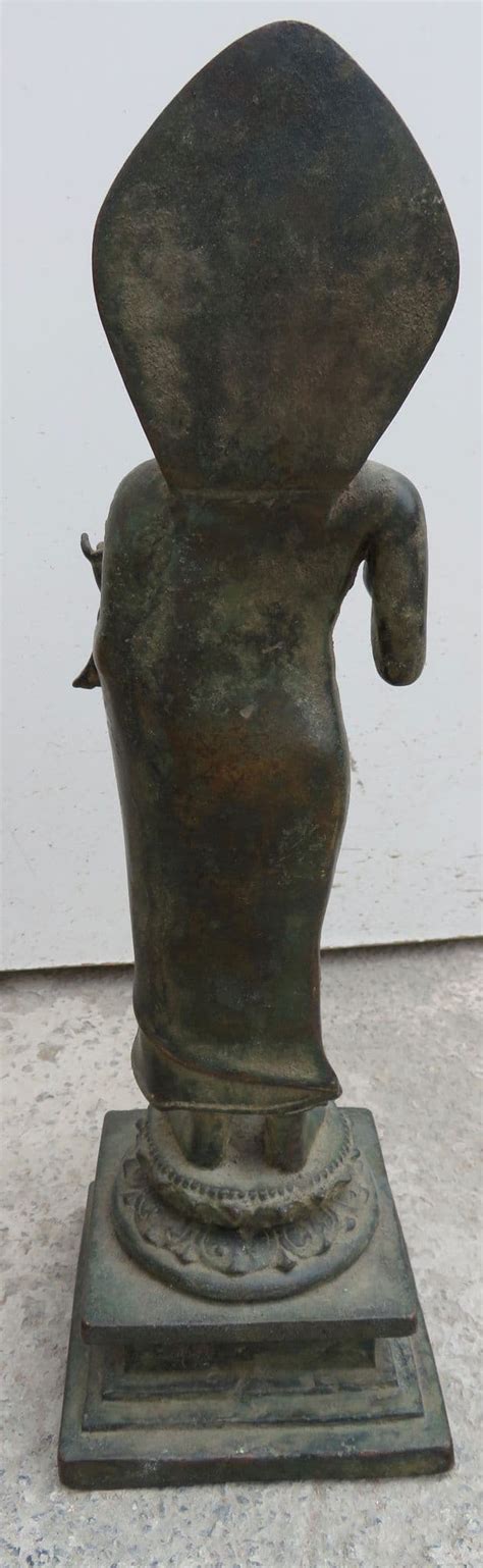 a copper alloy figure of standing buddha java 10th 12th century