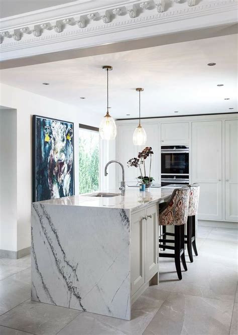 Modern Kitchen With Marble Countertops And Island