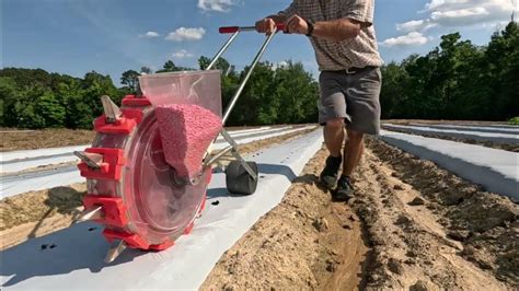 How We Plant Seeds Through Plastic Mulch Youtube
