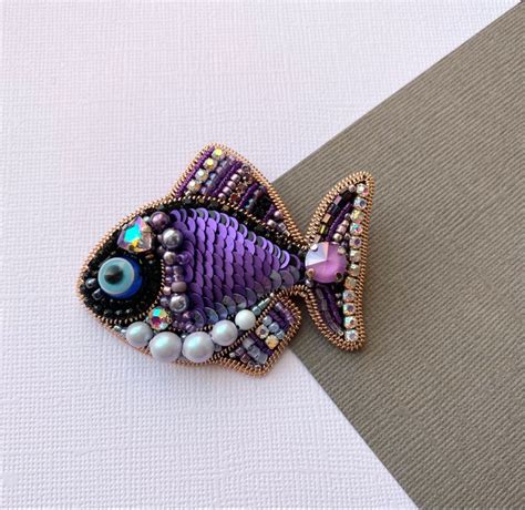 Брошь рыбка Spille Orecchini Bracciali