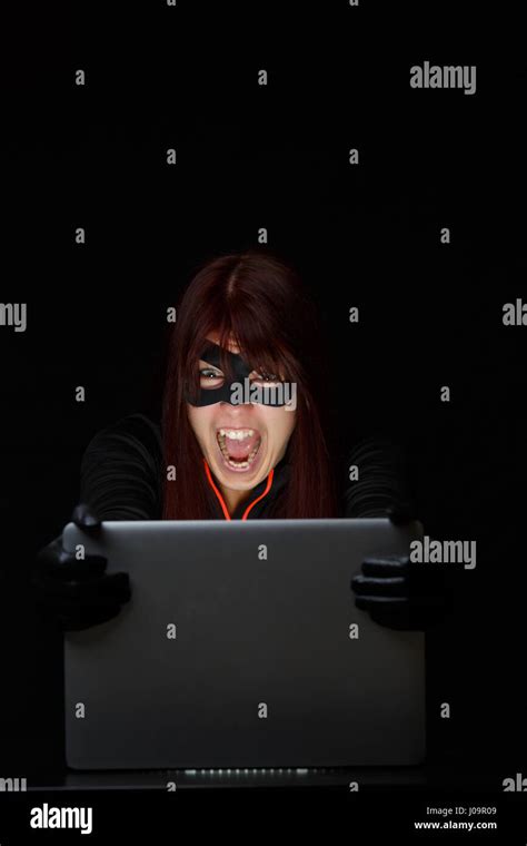 Screaming Female Hacker At Night Stock Photo Alamy