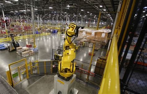 Hands Heads And Robots Work In Sync At Amazon Warehouses The Seattle