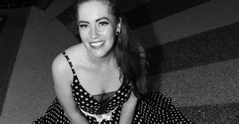 Black And White Photo Of Woman In Polka Dot Dress Sitting On Floor