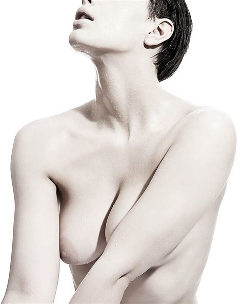 Nude Woman With Liquid Droplets On Skin License Image Lookphotos