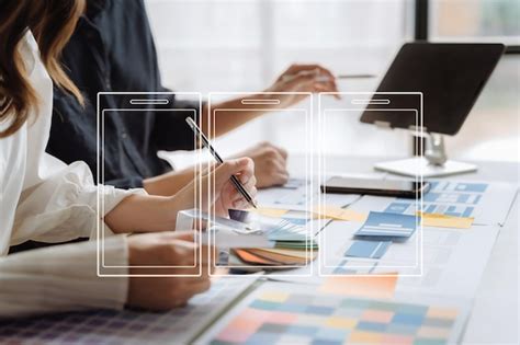 Premium Photo Ui Designer Brainstorming About Mobile App Interface