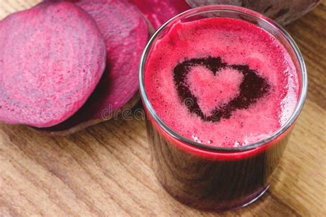 Fresh Beet Juice In Glass Heart Shape Foam And Sliced Beetroot On