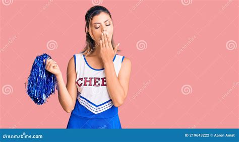 Young Beautiful Woman Wearing Cheerleader Uniform Bored Yawning Tired