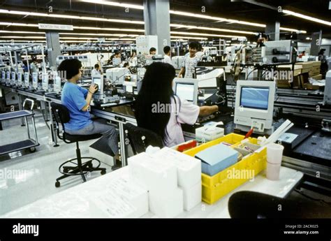Computer Assembly Plant Workers Assembling Computers At Factory In Computer Assembly Plant Workers Assembling Computers At Factory In