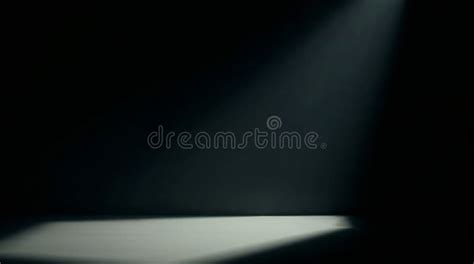 Light Beam Illuminating Dark Room Corner Creating Dramatic Atmosphere