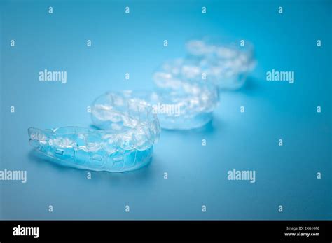 Invisible Aligners On A Blue Background With Copy Space Plastic Braces