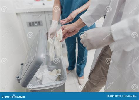 Medical Waste Disposal By The Professionals In A Surgery Room Stock