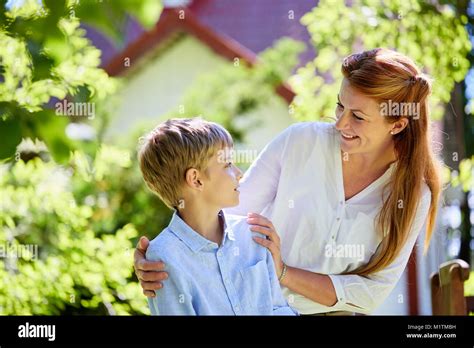 Happy Mother And Son At Summer Garden Stock Photo Alamy