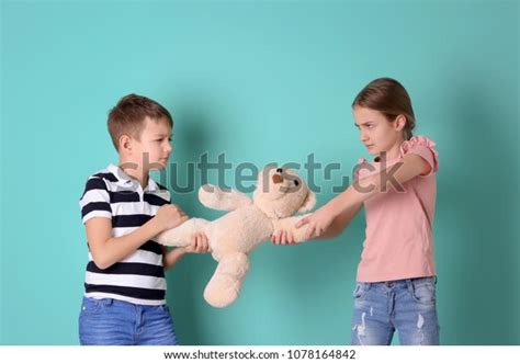 Brother Arguing Sister On Color Background Stock Photo Shutterstock