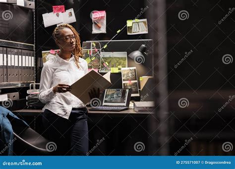 Detective Reading Crime Case File And Thinking About Clues Stock Image