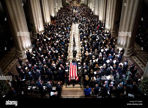 The Honor Guard Carries The Casket Of Former President George Herbert