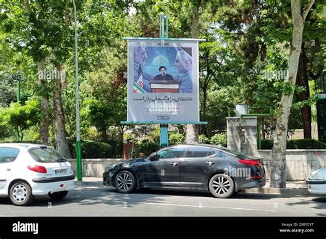 Ebrahim Raisi Qasem Soleimani And Mohsen Fakhrizadeh All On A Banner Hung On A Street In