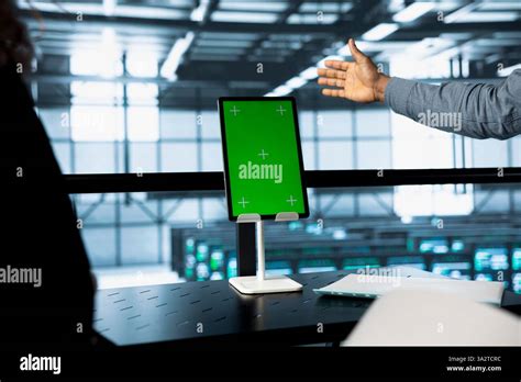 Engineers Using Isolated Screen Tablet In Data Center Managing Server