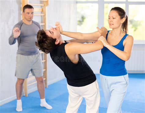 Self Defense Class A Woman Practices Blows To The Head Of An