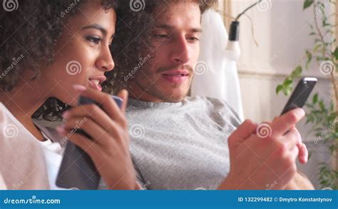 Couple Sharing Mobile Phone In Bed Stock Footage Video Of Expression Adult