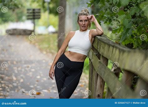 Blonde Beauty Exudes Confidence And Vitality In Sleek Workout Gear After Intense Outdoor Session