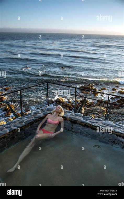 Usa California Big Sur Esalen A Woman Sits In The Baths And Relaxes