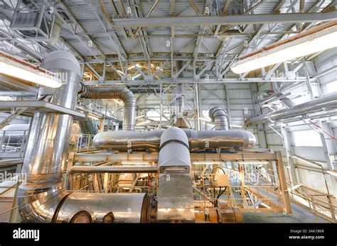 Chemical Plant Interior Showcasing Extensive Pipelines And Conveyors