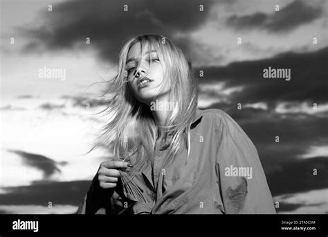 Sensual Blonde Woman Beautiful Girl On Dramatic Sky Beautiful Girl