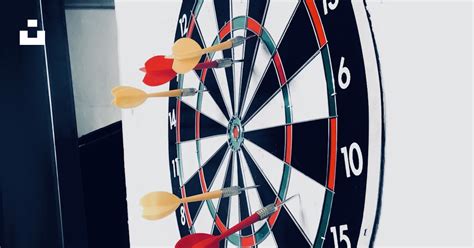 dart stuck on board photo free game image on unsplash