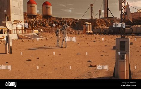 Two Astronauts Scientists In Spacesuits Walk On Mars Surface Research