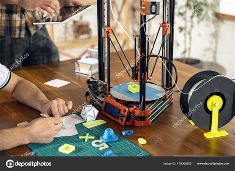 New Generation Of 3d Printing Machine Printing A Piece Of Plastic For Use In Small Spaces