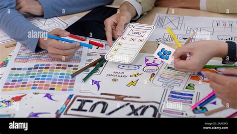 Creative Ux Developer And Ui Designer Brainstorming Session With Color Palettes Wireframes And