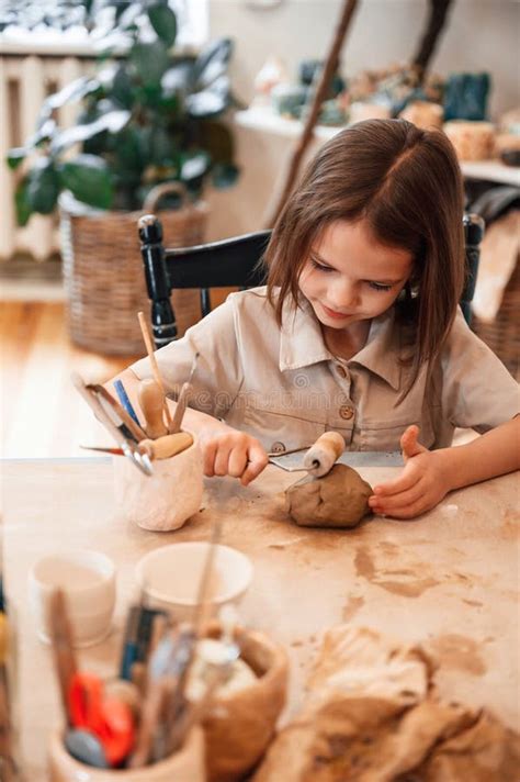 Learning How To Craft Origami Father And Son Are At Home By The Table