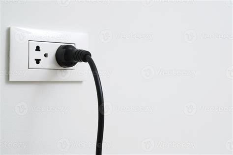 Close Up The Electrical Power Socket And Plug Socket On Wall 22572966