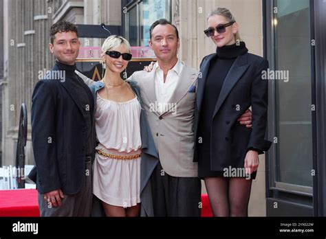 Raff Law From Left Iris Law Jude Law And Phillipa Coan Pose With