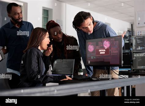 Team Of Software Developers Having Web Server Hacked Reading Critical