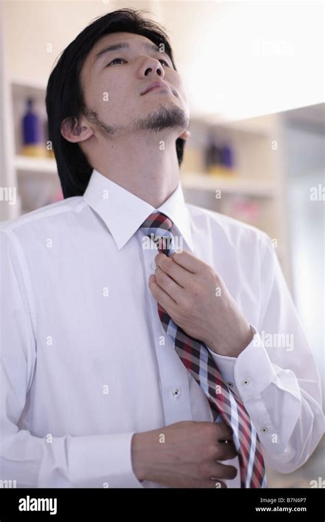 Man Adjusting His Tie Stock Photo Alamy