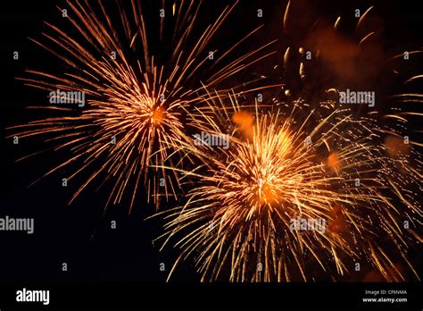 Pyrotechnic Show Bright Fireworks Explosions In The Night Sky Stock