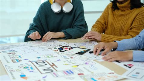 Developer Team Collaborating And Planning Template Layout For Mobile