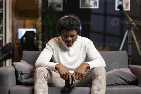 Gamer Wearing Headphones Crying From Frustration After Getting Game Over Message While Playing